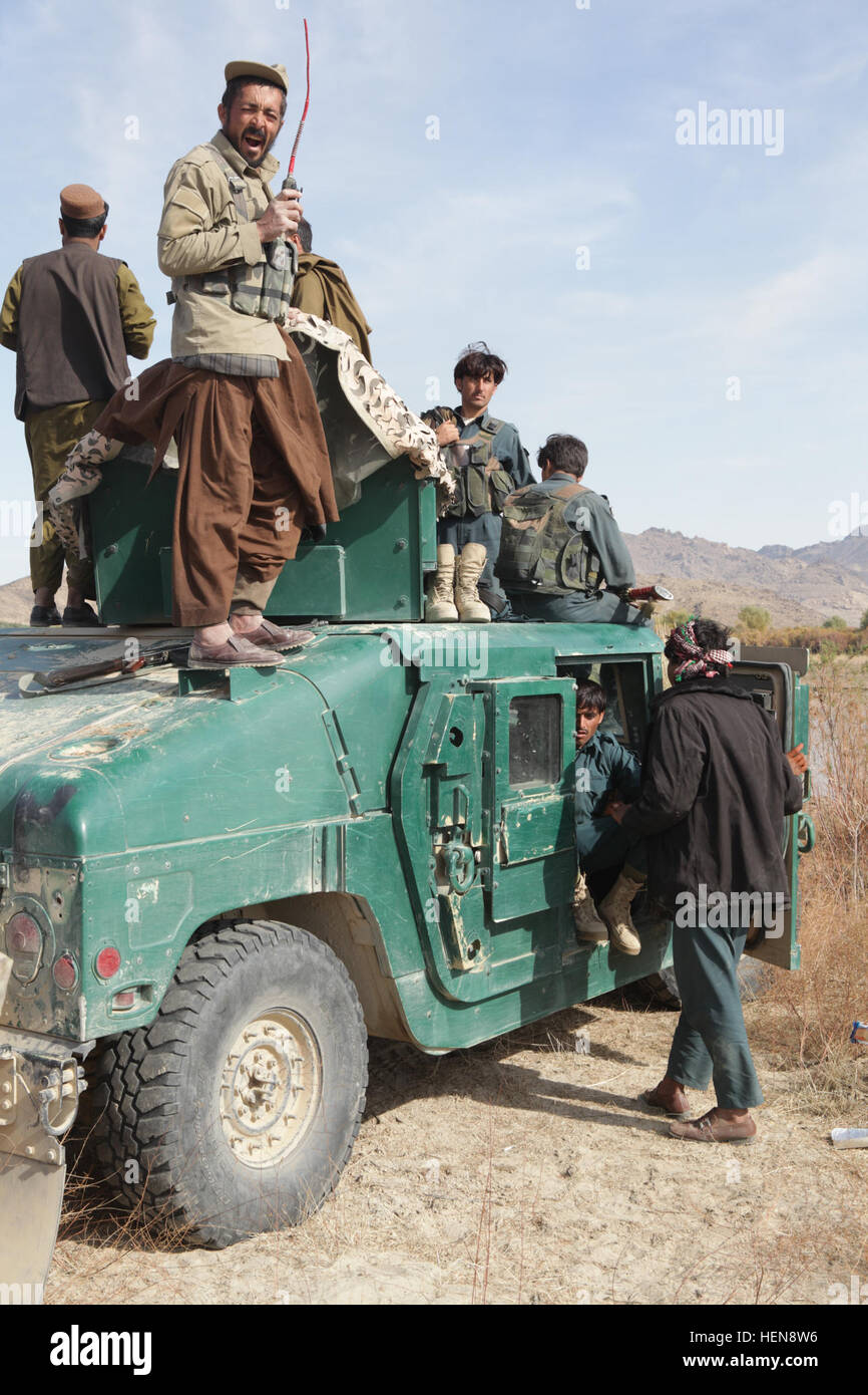 Afghan National Army soldiers pull security as other members of the ...