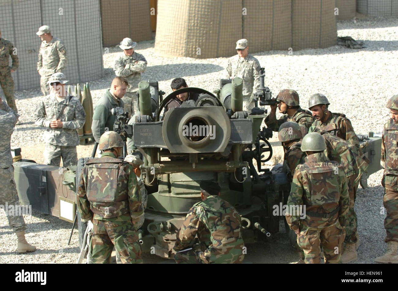 An Afghan National Army artillery peers through the firing tube as part ...