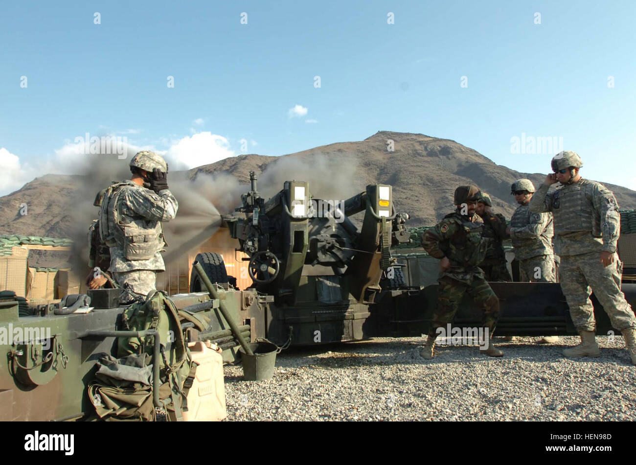 U.S. Army Staff Sgt. Trenton R. Farris, left, 1st section chief of 2nd ...