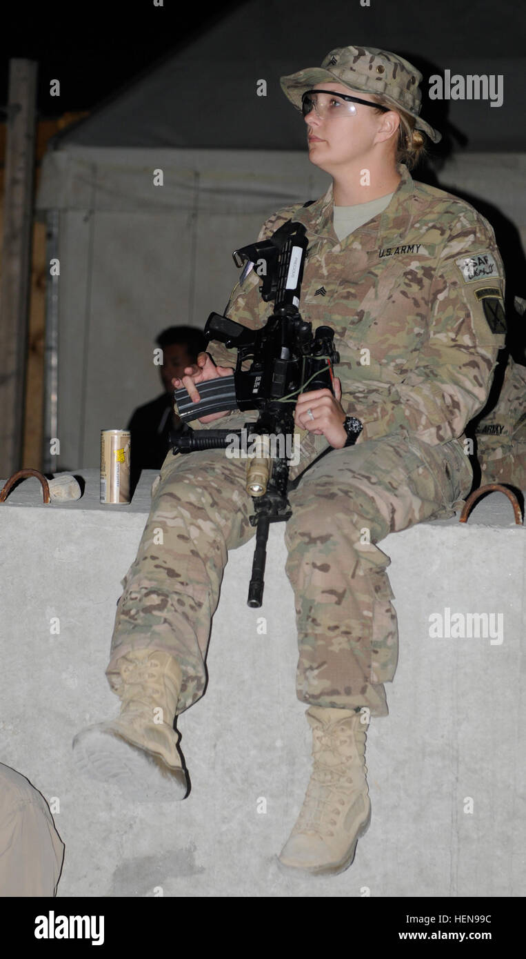 U.S. Army Sgt. Anna Simms sits on top of a bunker at Forward Operating ...