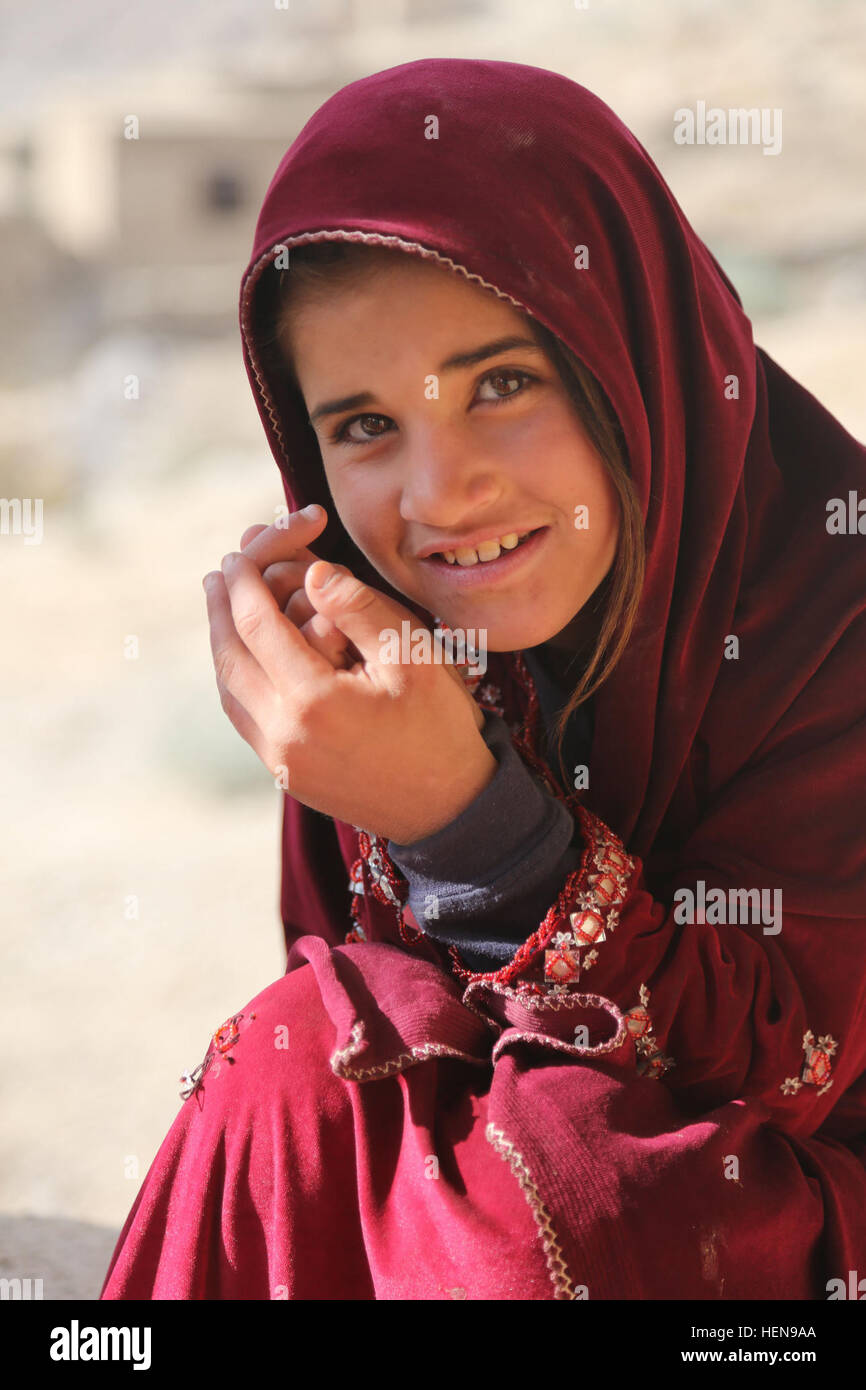 An Afghan child poses for a photo in Sarobi district, Kabul province ...