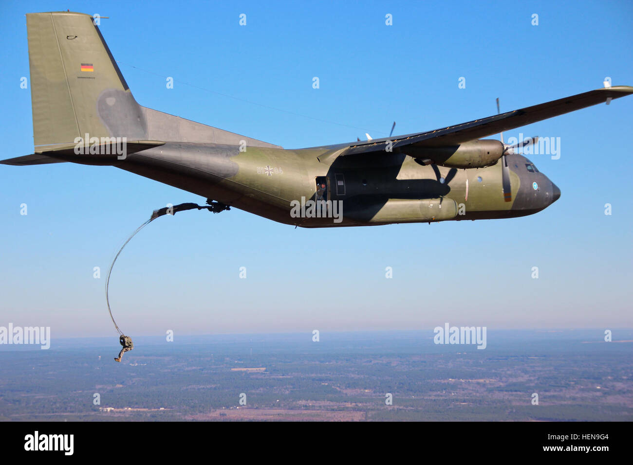 A paratrooper jumps from a German C-160, Dec. 11, 2013, during ...