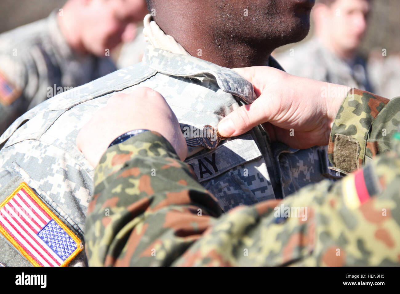 A paratrooper is pinned with German jump wings, Dec. 11, 2013, on Luzon ...
