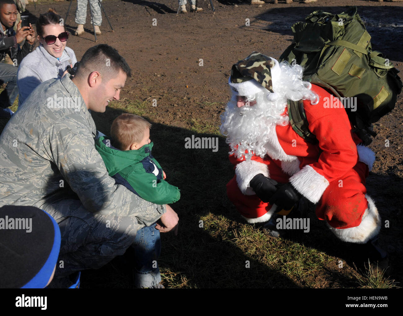 Santa Claus hands out toys to children after performing an airborne ...