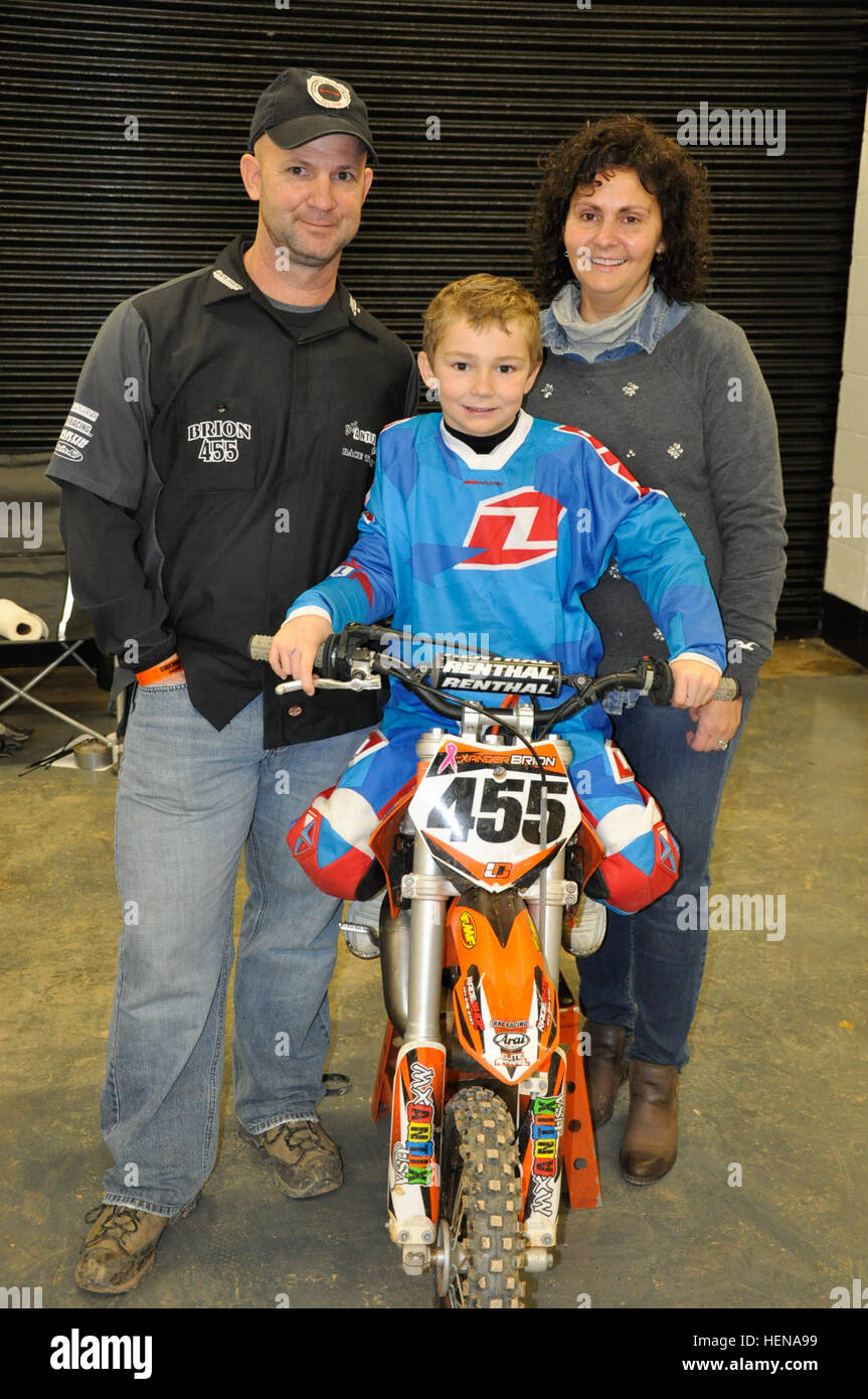 (Center) Eight year old Alexander "Xander" Brion, poses with his father ...