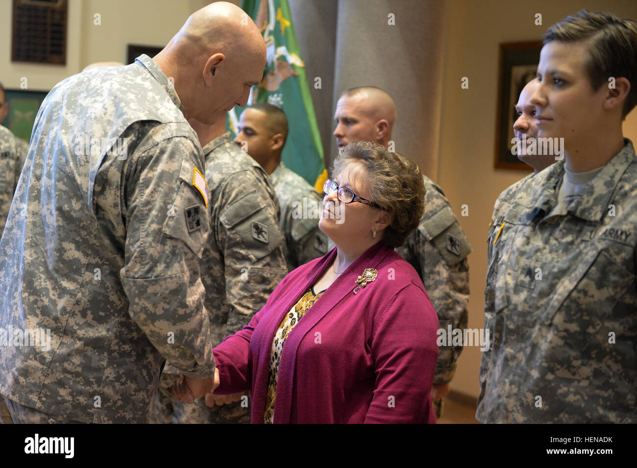 U.S. Army Chief of Staff Gen. Ray Odierno shakes the hand of a civilian ...