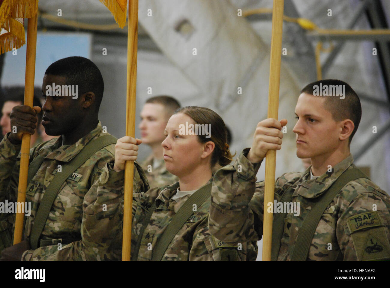 U.S. Soldiers present flags during a transfer of authority ceremony at ...