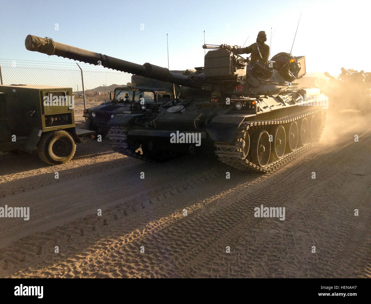 A Type 74 Main Battle Tank of the Japan Ground Self-Defense Force rolls ...