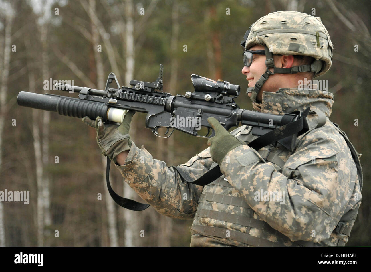 A U.S. Army Military Police soldier from the 615th MP Company loads a ...