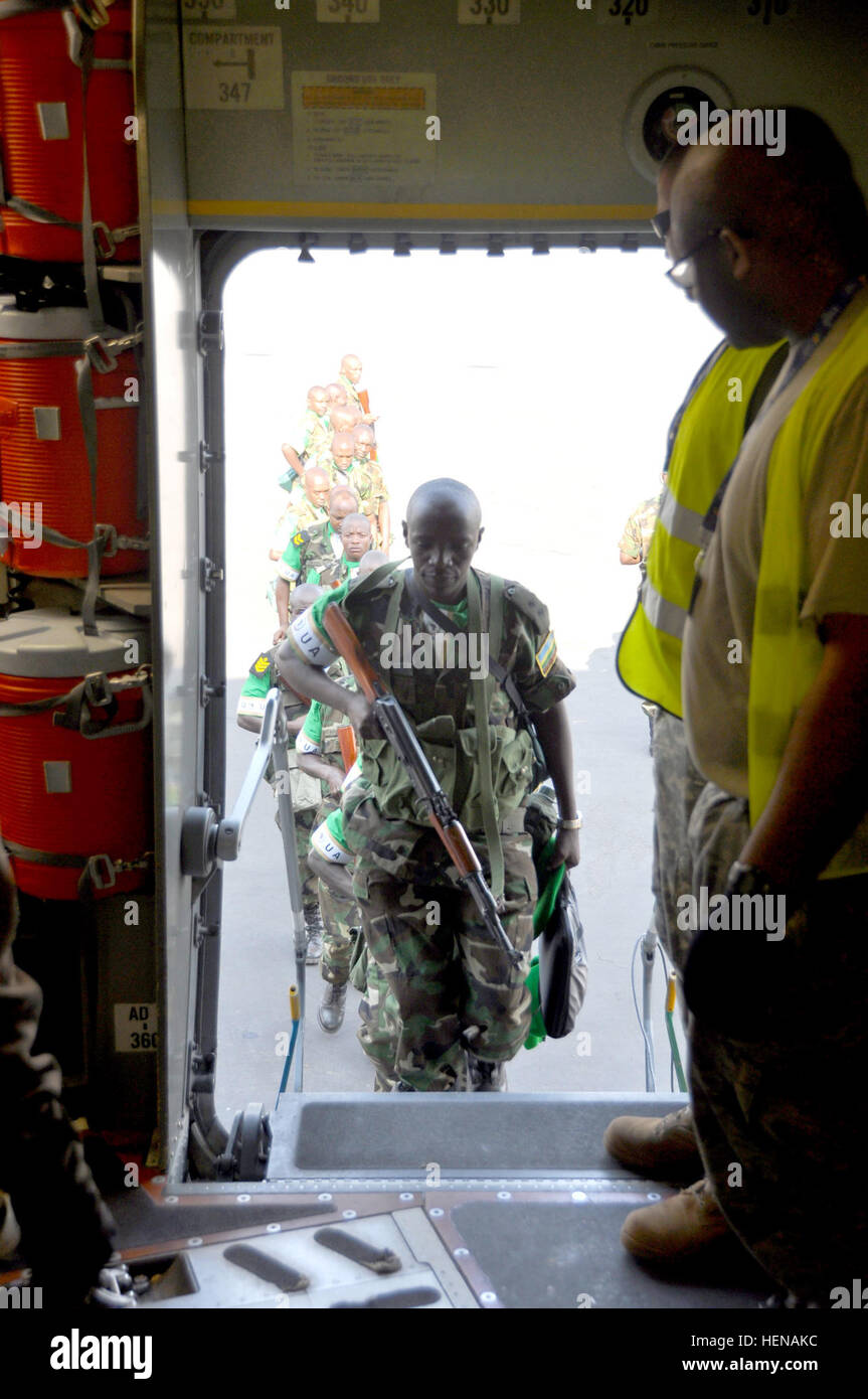 Members of the Rwanda Defense Force board a U.S. Air Force C-17 ...