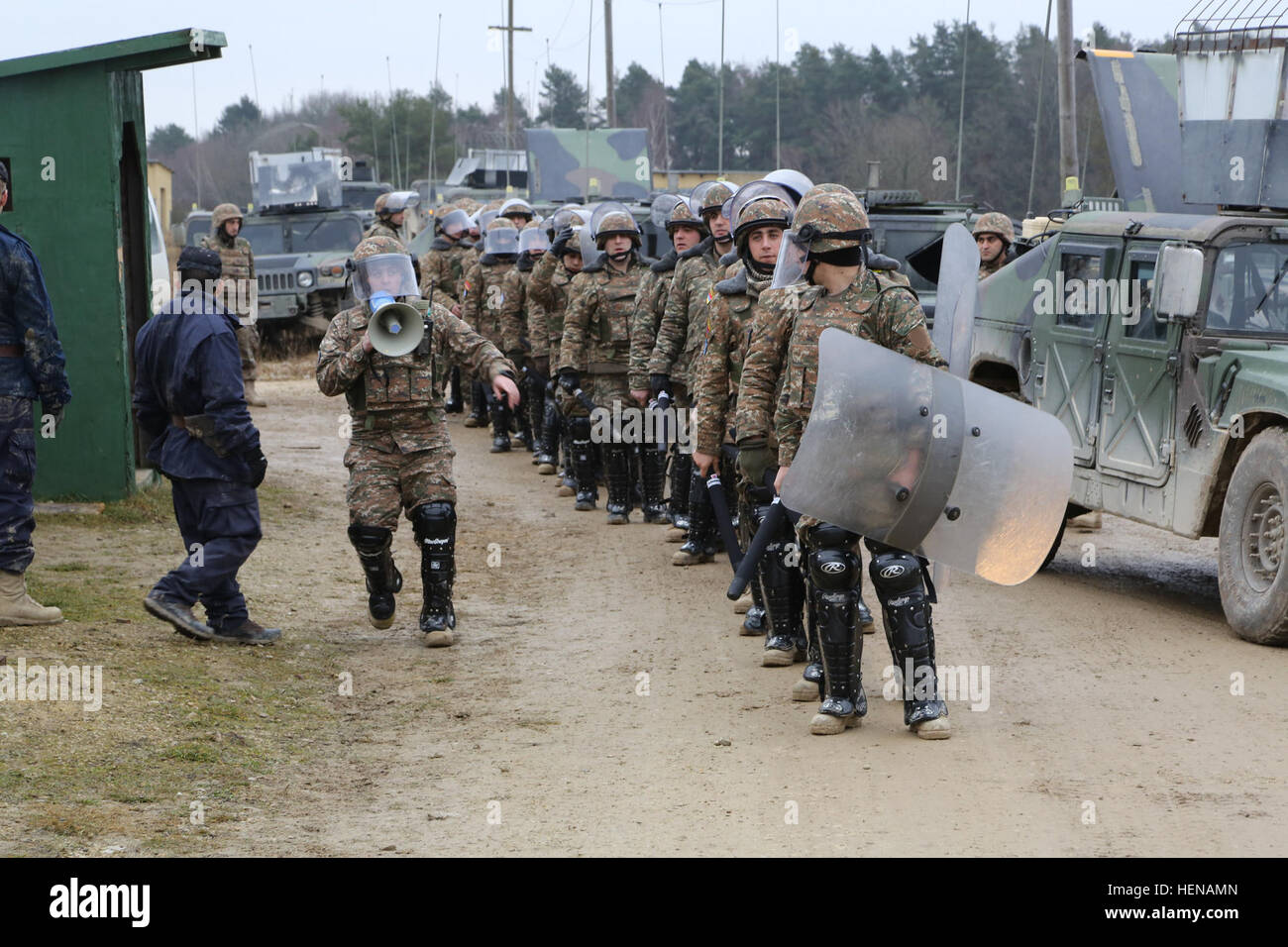 Armenian soldiers prepare to conduct a riot control training scenario ...