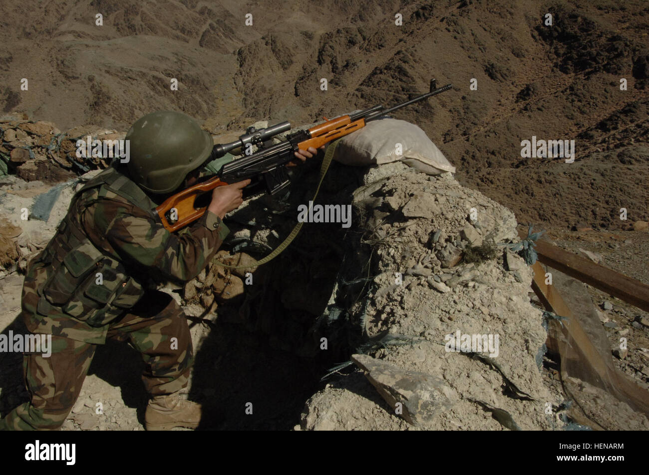 An Afghan National Army soldier uses a Dragunov sniper rifle during a ...