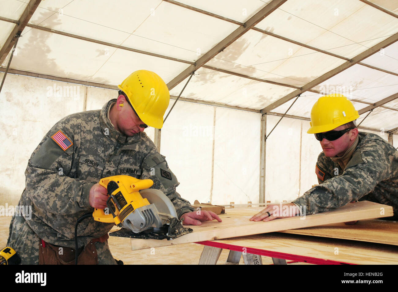 Sgt. Aleksey Semenov, a vertical construction engineer with the 902nd ...