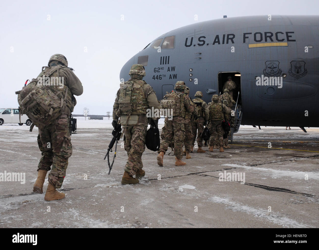 Soldiers from the 2nd Brigade Combat Team, 101st Airborne Division (Air Assault), depart a bus ...