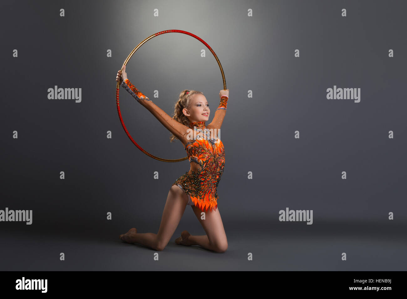 Gymnast girl performing with hoop at studio Stock Photo - Alamy