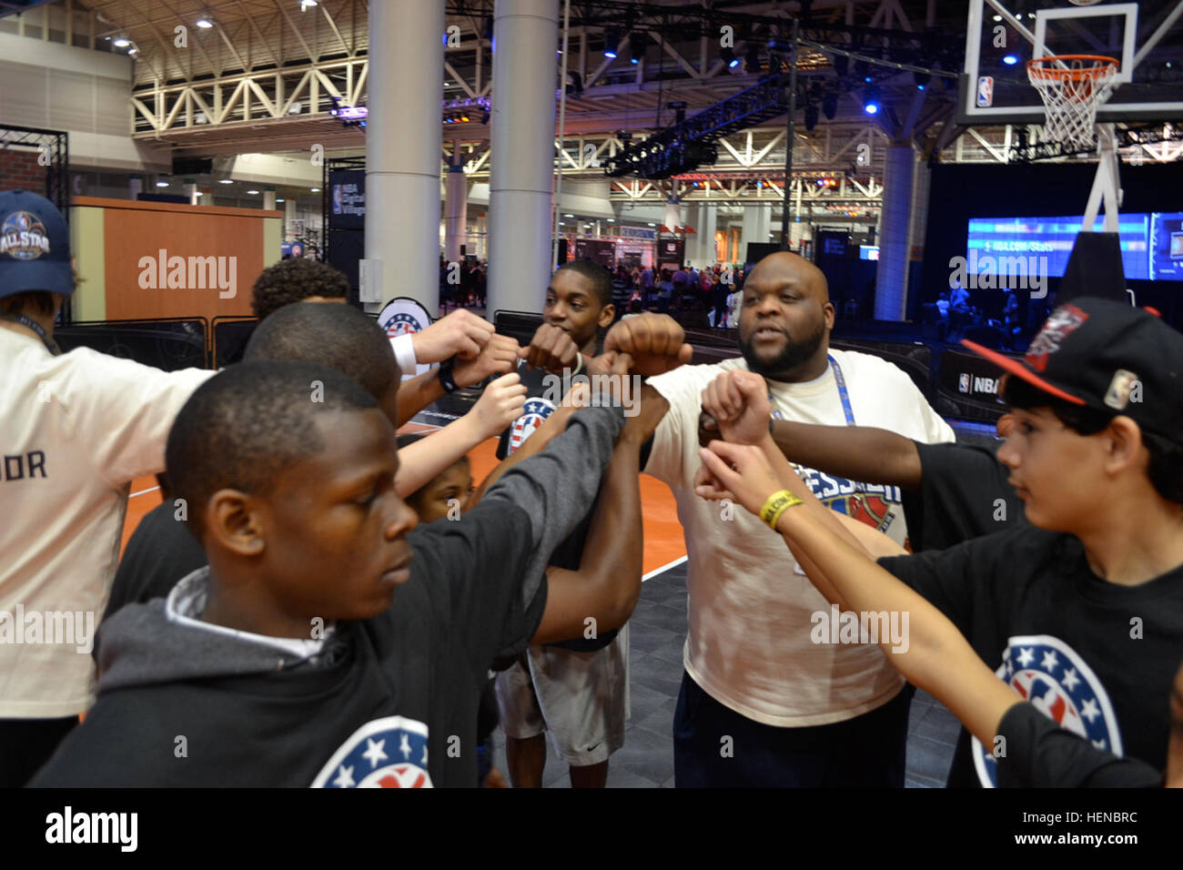 Children of U.S. service members break from a huddle during the NBA ...