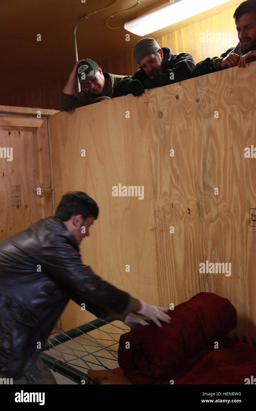 An Afghan Border Police member searches a bed during a tactical site ...