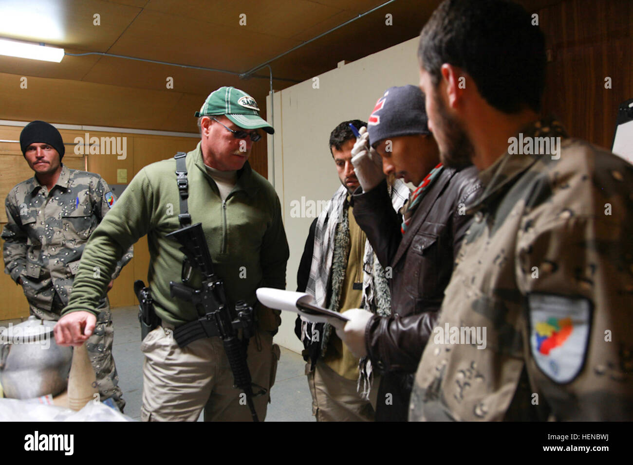 Security Force Advise and Assist Team 9 adviser Mike Kuchac observes ...