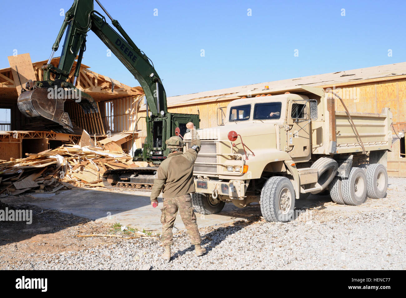 While deconstructing a building with a hydraulic excavator, engineers ...