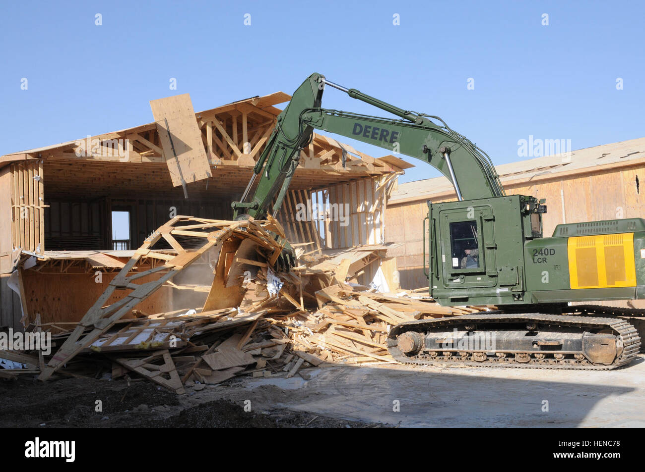 Engineers from the 489th Engineer Battalion use a hydraulic excavator ...