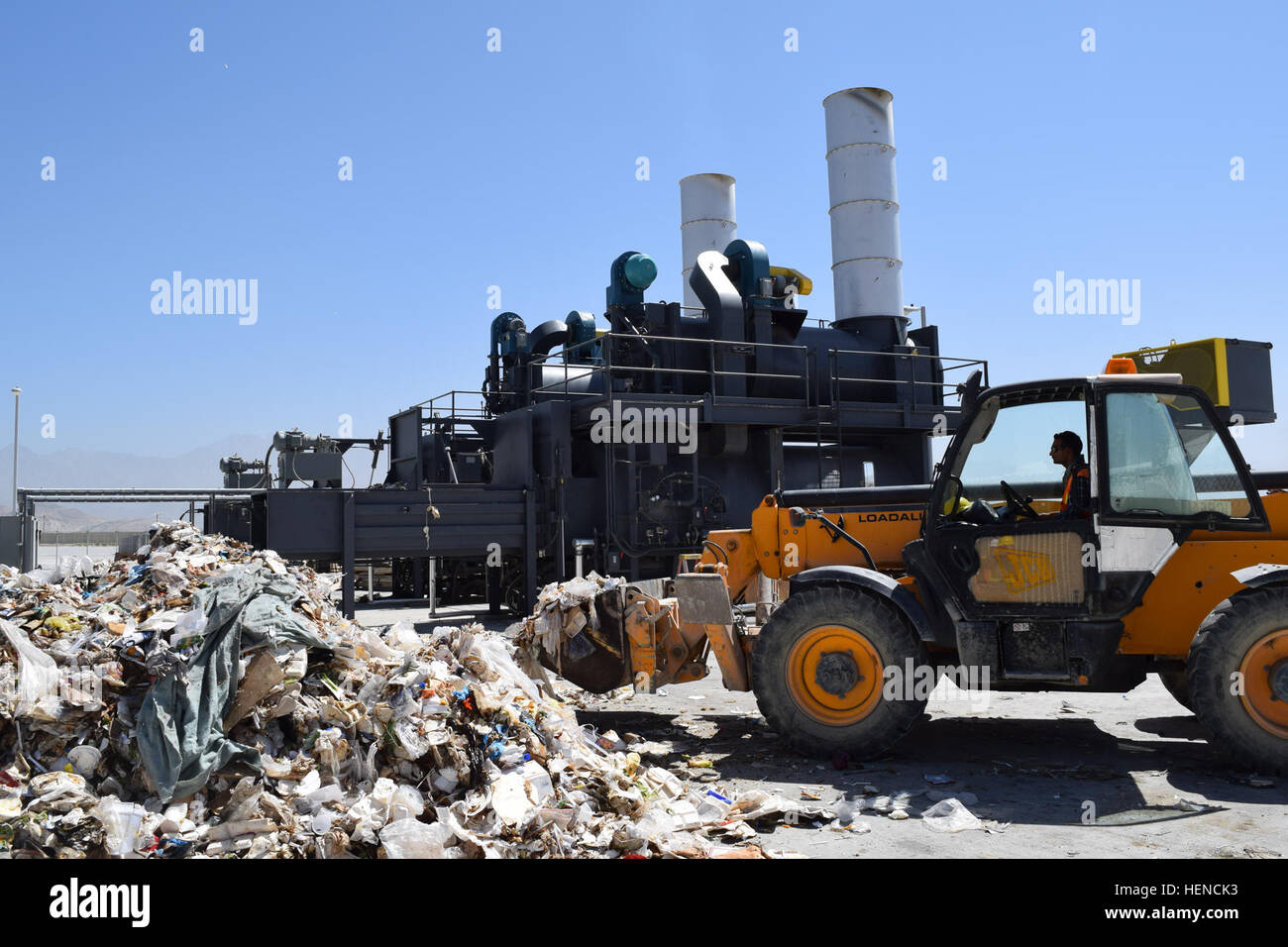 A JCB Loadall picks up trash at the new Waste Management Complex ...