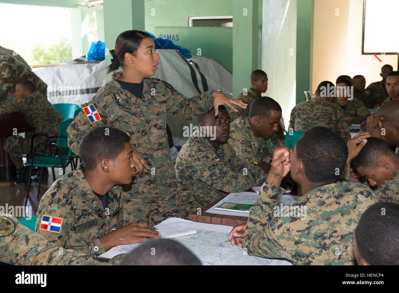 Dominican Republic Army 2nd Lt. Maria Florimon, standing, gives ...
