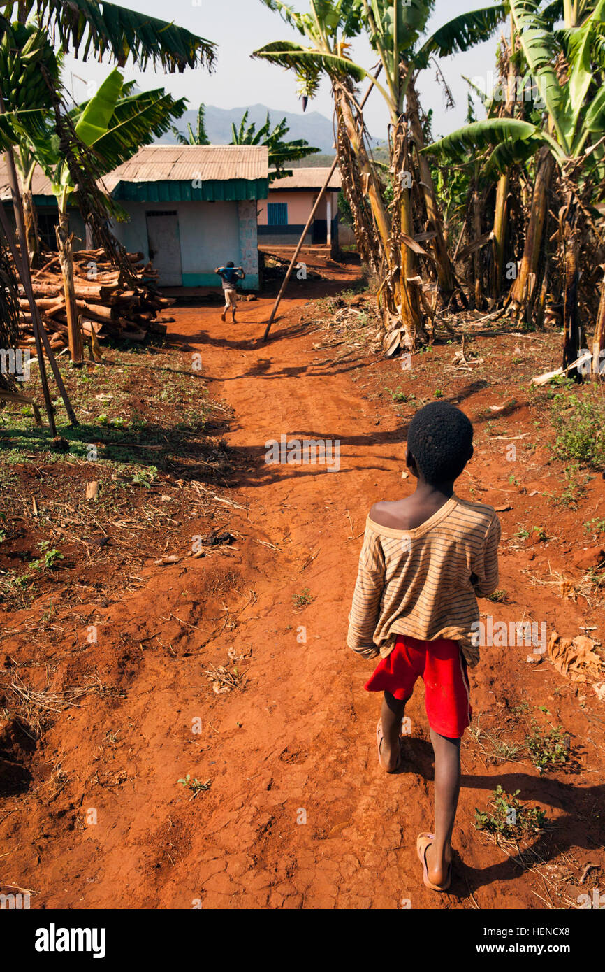 A young Cameroonian boy walks down a dirt road during Central Accord ...