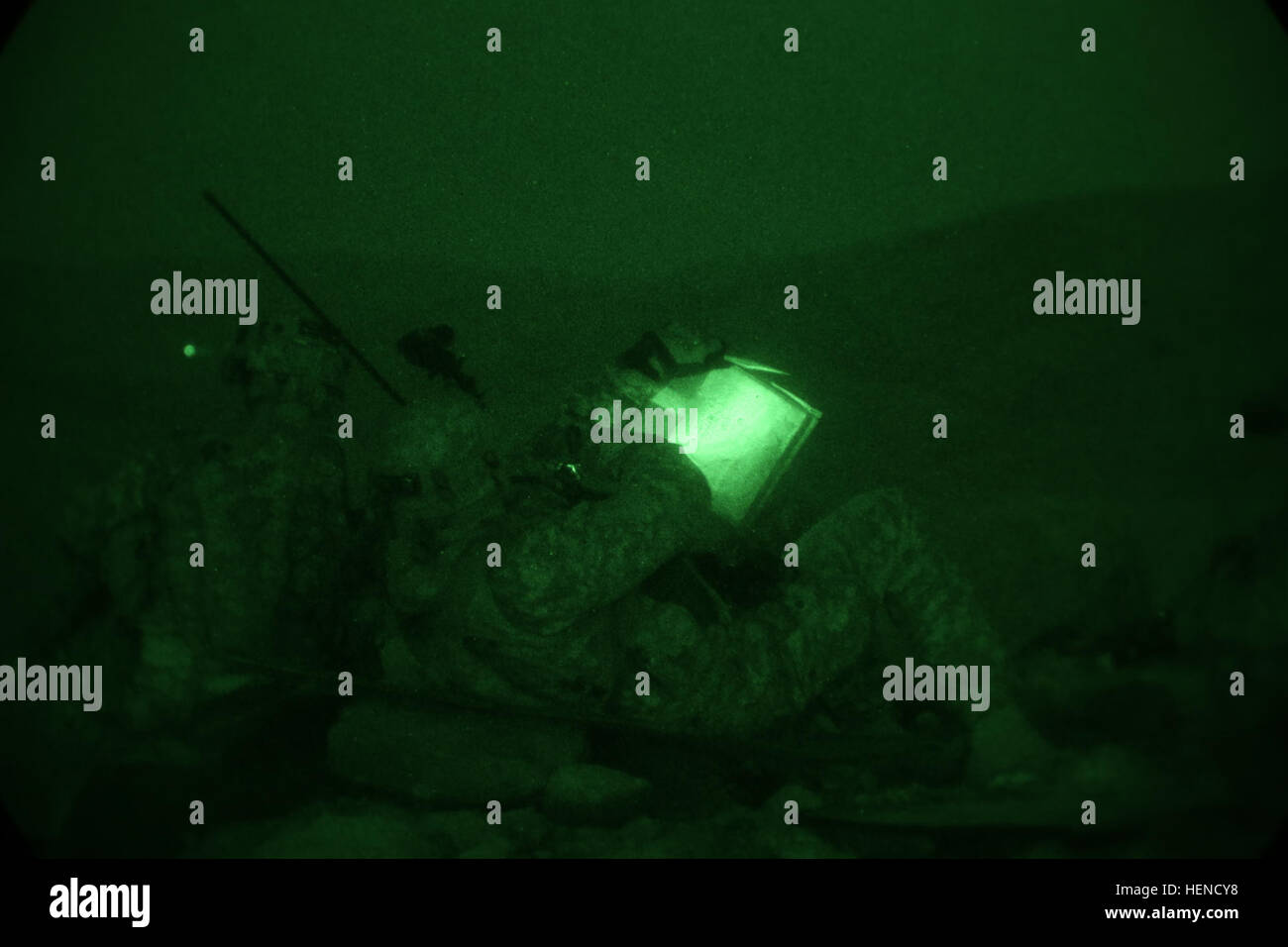 A U.S. Army soldier from 3rd Stryker Cavalry Regiment looks at his map ...