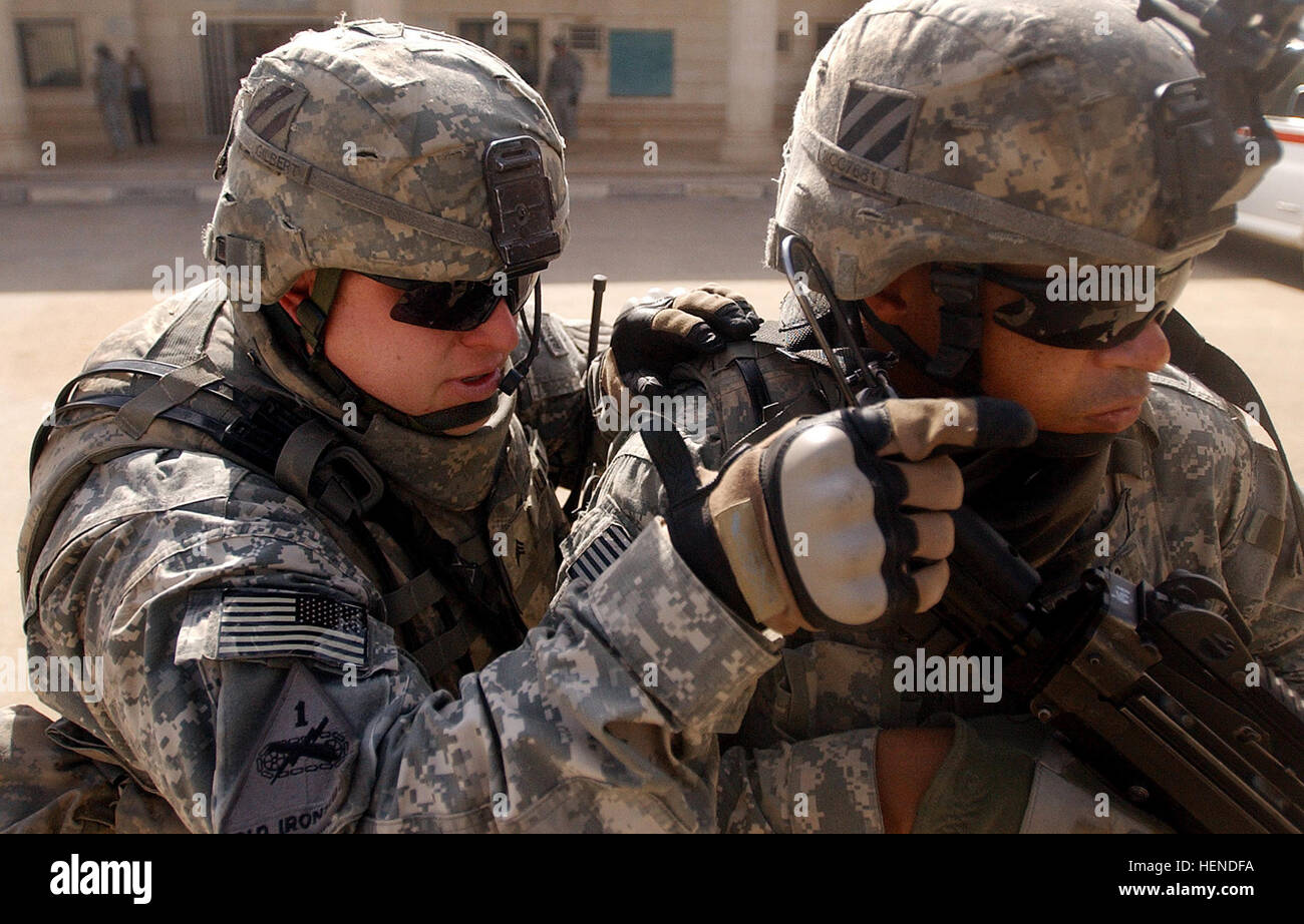 Sgt. Bobby Gilbert, left, points out to Spc. Jason Collins an area in a ...