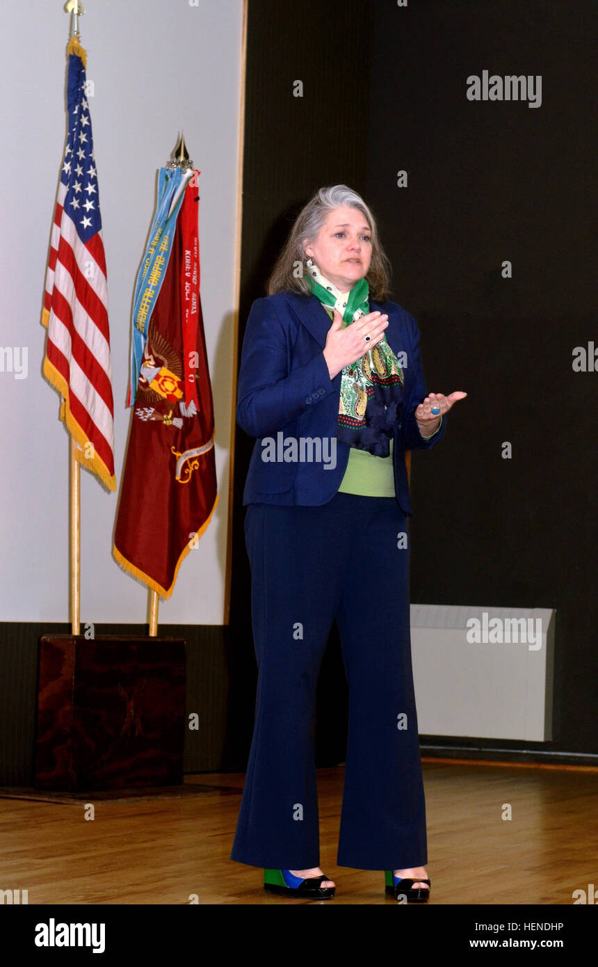 Christine Kindt, a retired sergeant first class, speaks with a group ...