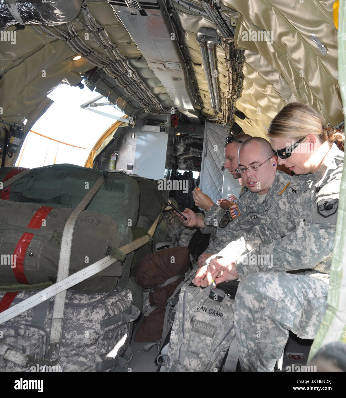 Spc. Heidi A Van Camp a geospatial engineer and Staff Sgt. Joshua Meyer ...