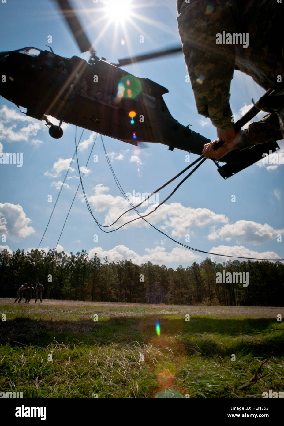 Fort Bragg Air Assault School students rappel from a UH-60 Blackhawk ...