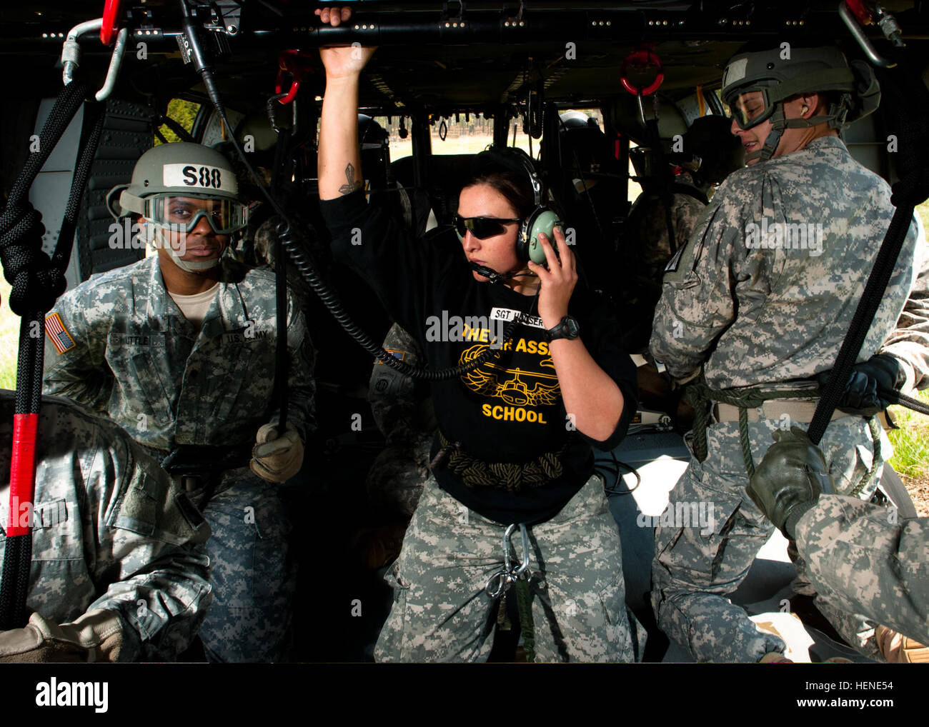 U.S. Army Sgt. Jenna Hooser, center, an instructor at the Fort Bragg ...