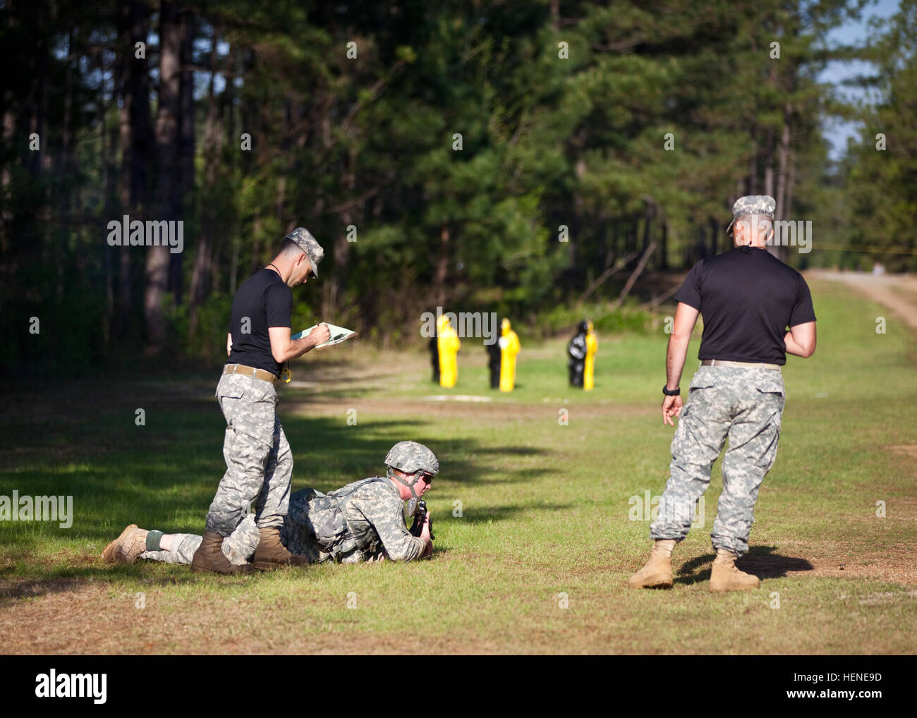 A U.S. Army Ranger is monitored by Ranger Instructors while maneuvering ...