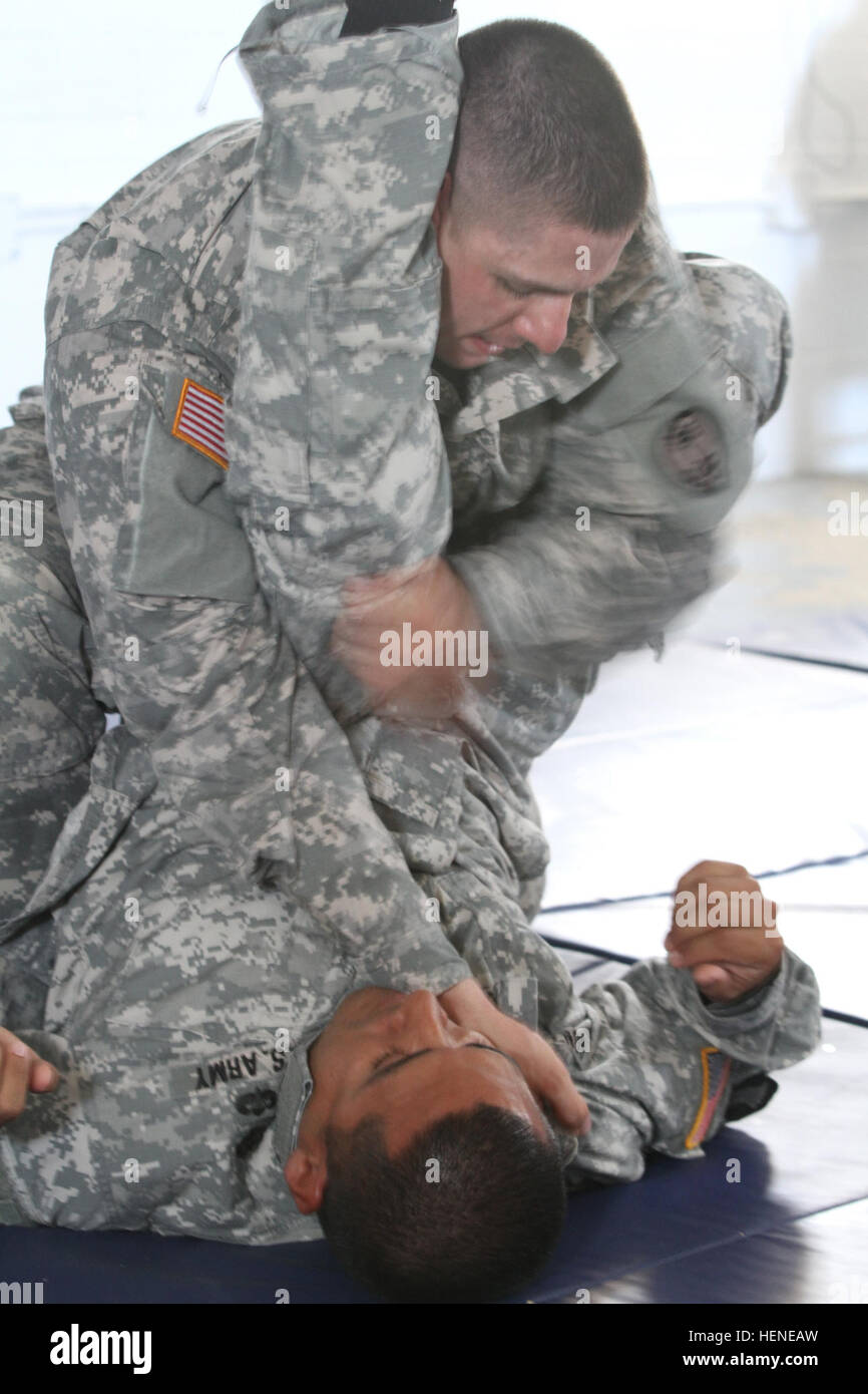 Staff Sgt. Luke Klein, with the 339th MP Company, demonstrates a ...
