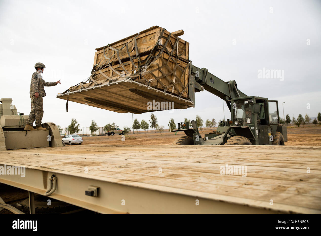 U.S. Army soldiers from the 42nd Combat Aviation Brigade load equipment ...