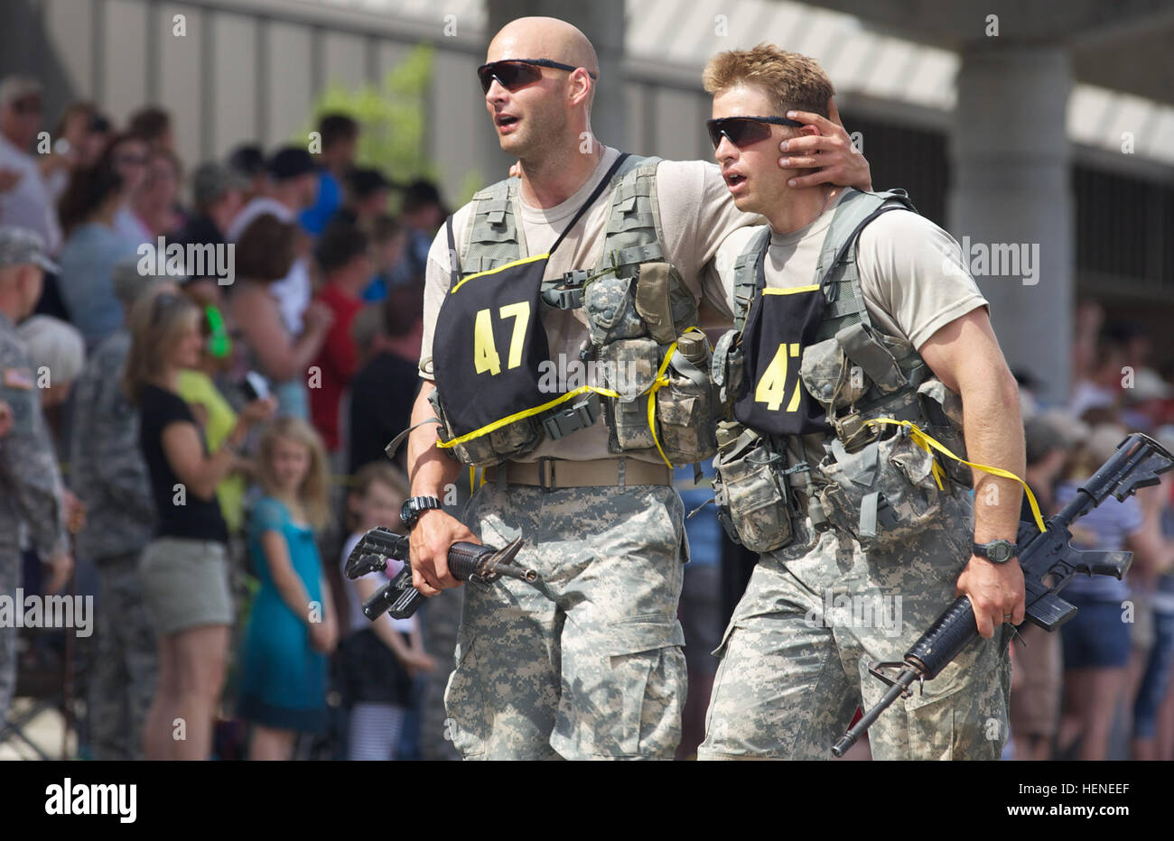 U.S. Army Staff Sgt. Eric Adams (right) and Cpl. Daniel Puckett ...