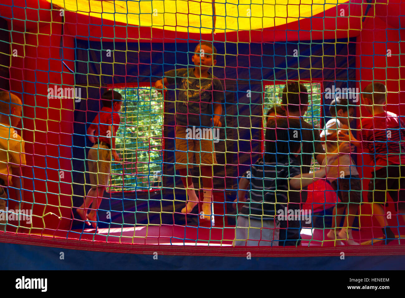Several children enjoy the bounce house at the 3rd Combat Aviation ...