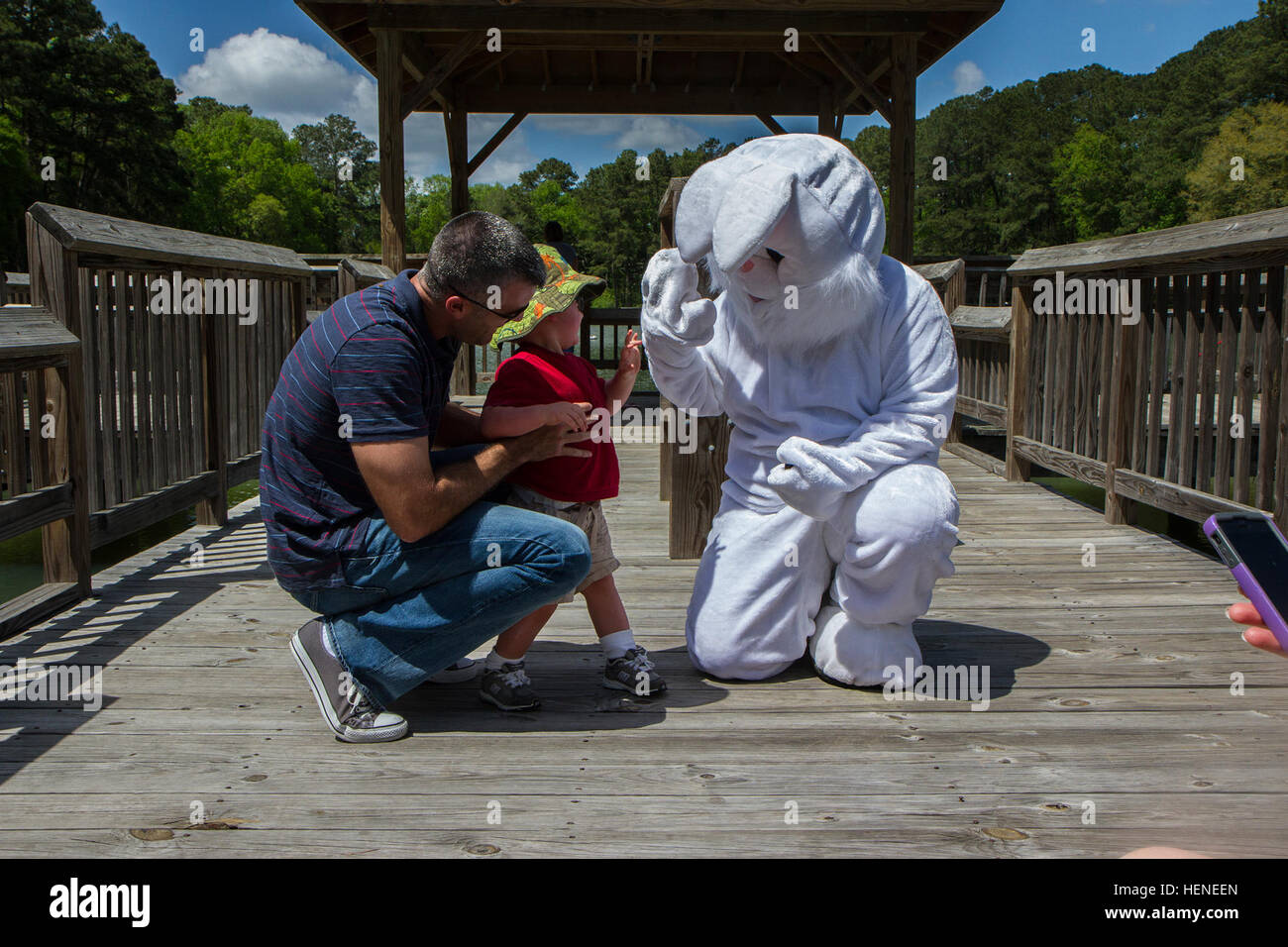 A young boy gives the Easter Bunny a high-five at the 3rd Combat ...