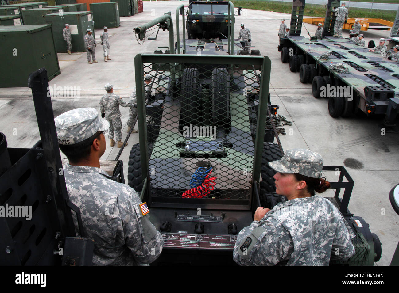 Pfc. John Cifuentes (left) and Pfc. Chelsea Woodruff (right) operate a ...