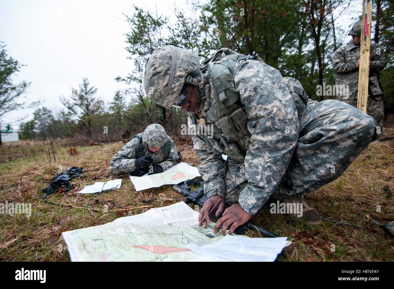 Soldiers plot their points on their maps before heading off into the ...