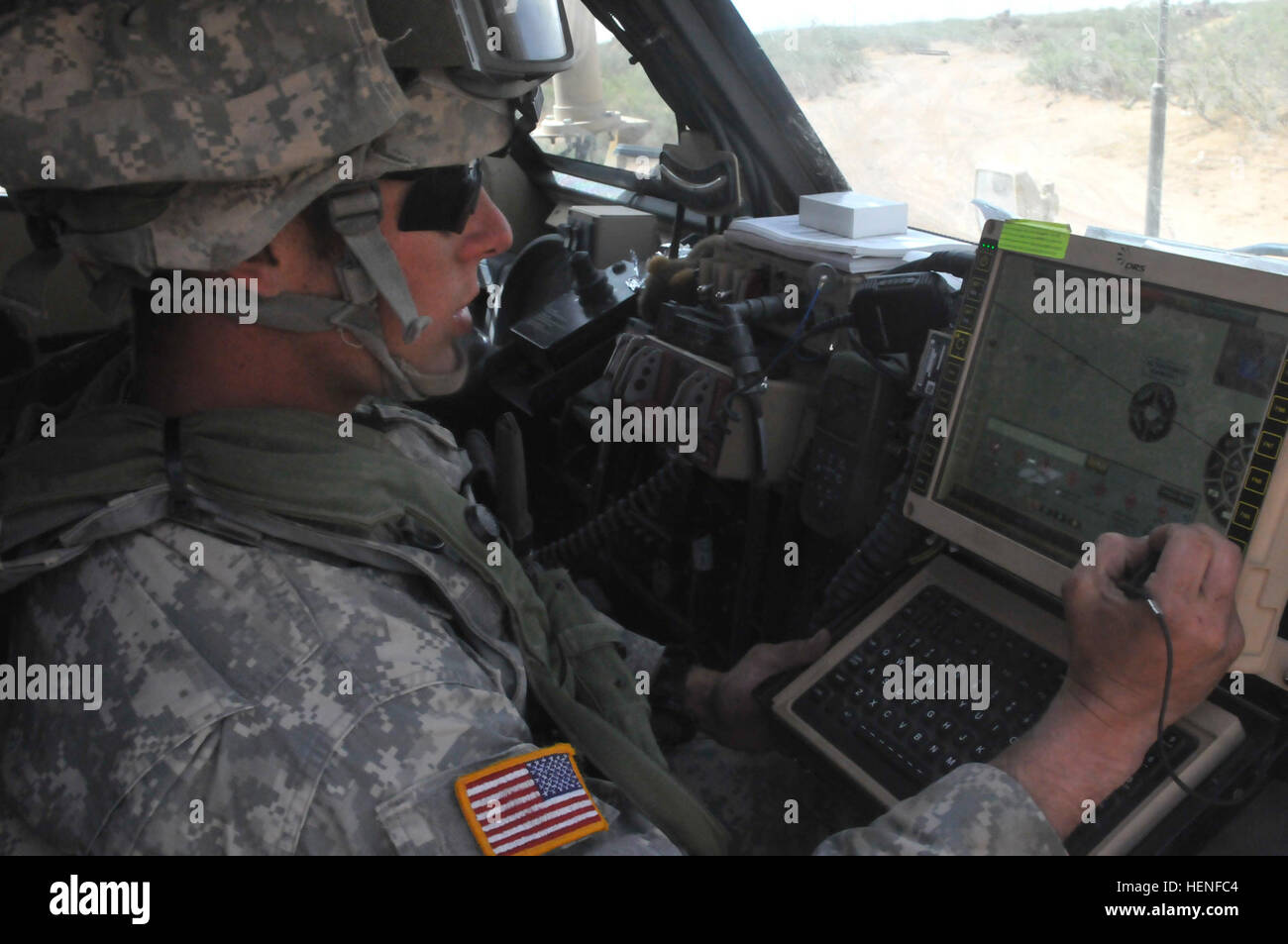 Spc. David Moore, a cavalry scout from Roanoke, Ala., watches troop ...