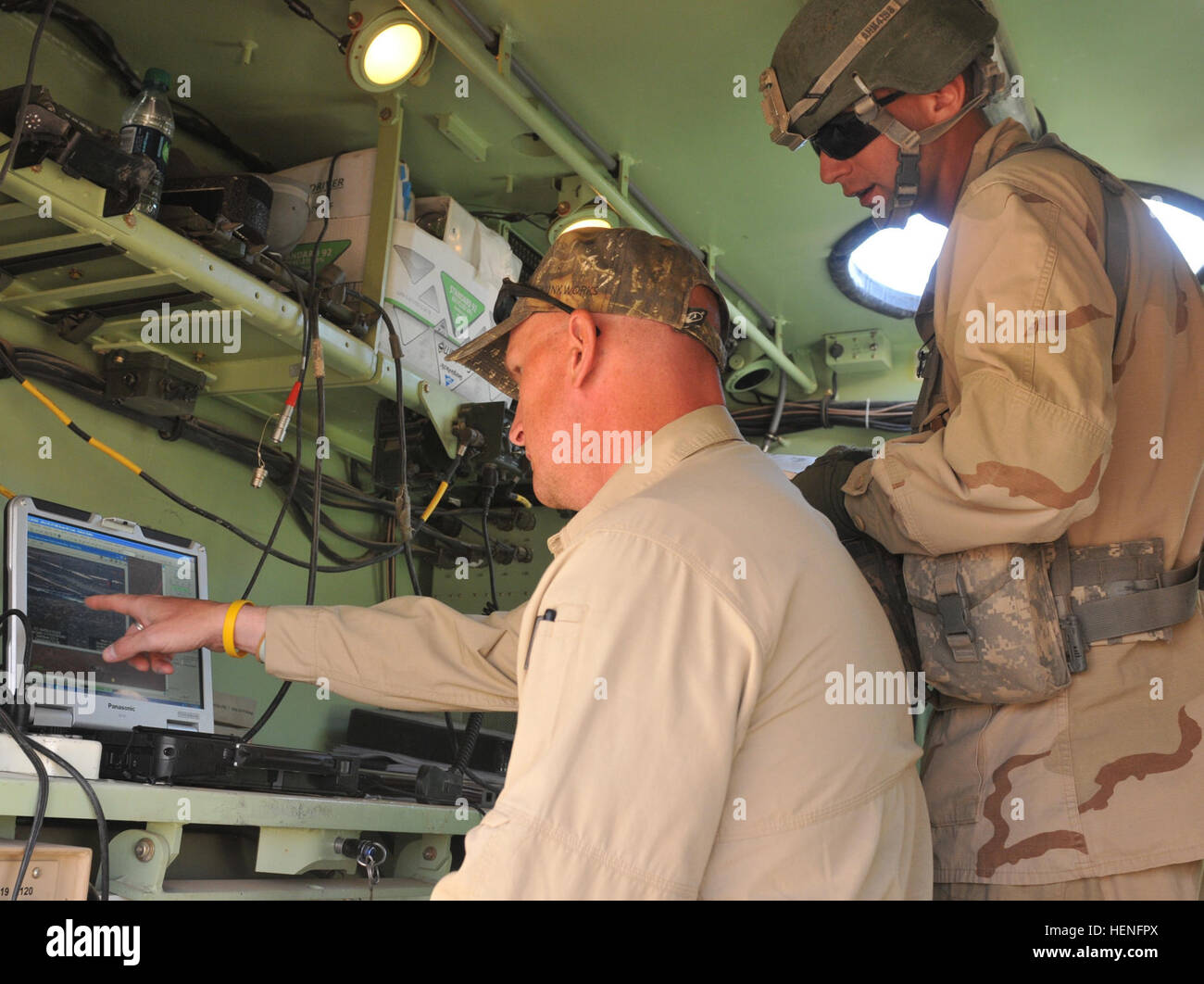 A Lockheed Martin representative shows Sgt. Chad Miramontes, a Forward ...