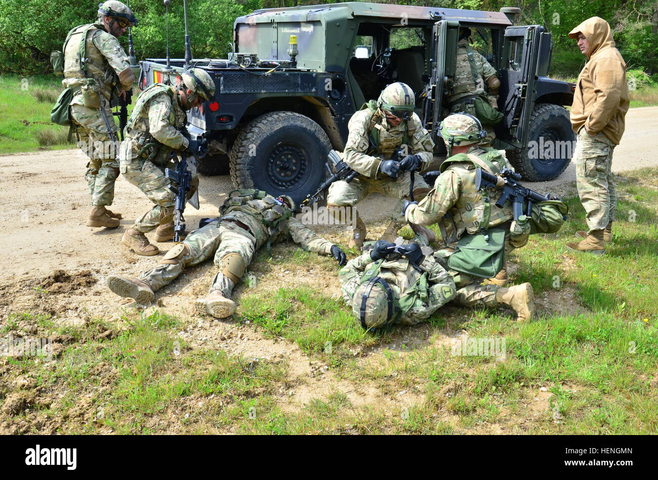 Georgian soldiers administer first aid to simulated casualties during ...