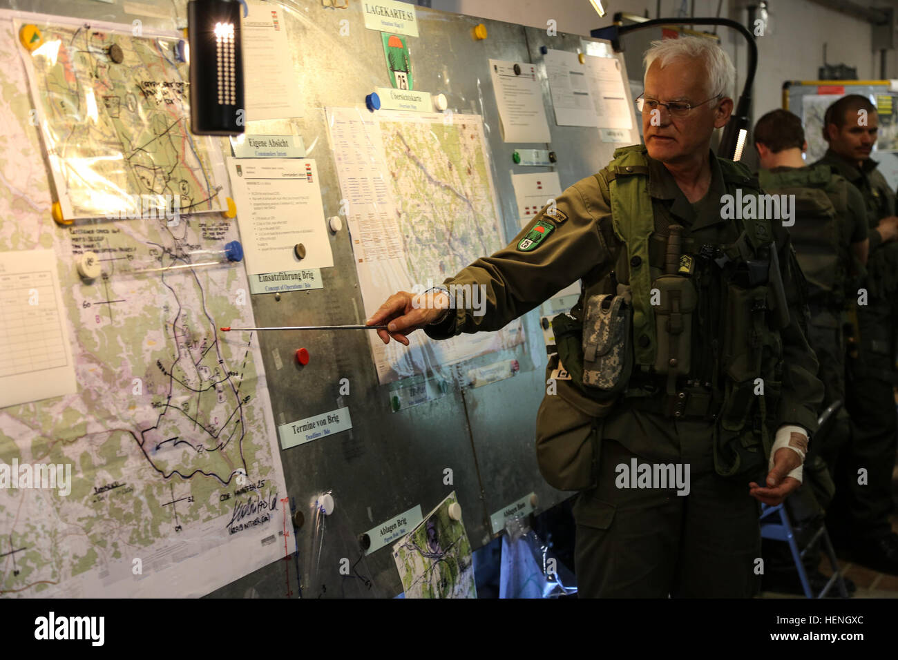 Austrian Land Forces personnel planned troop movements on a map during ...