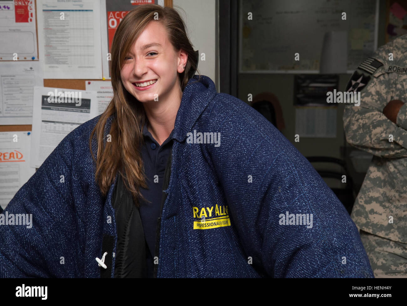 A student from the American School of Kuwait tries on the padded suit ...