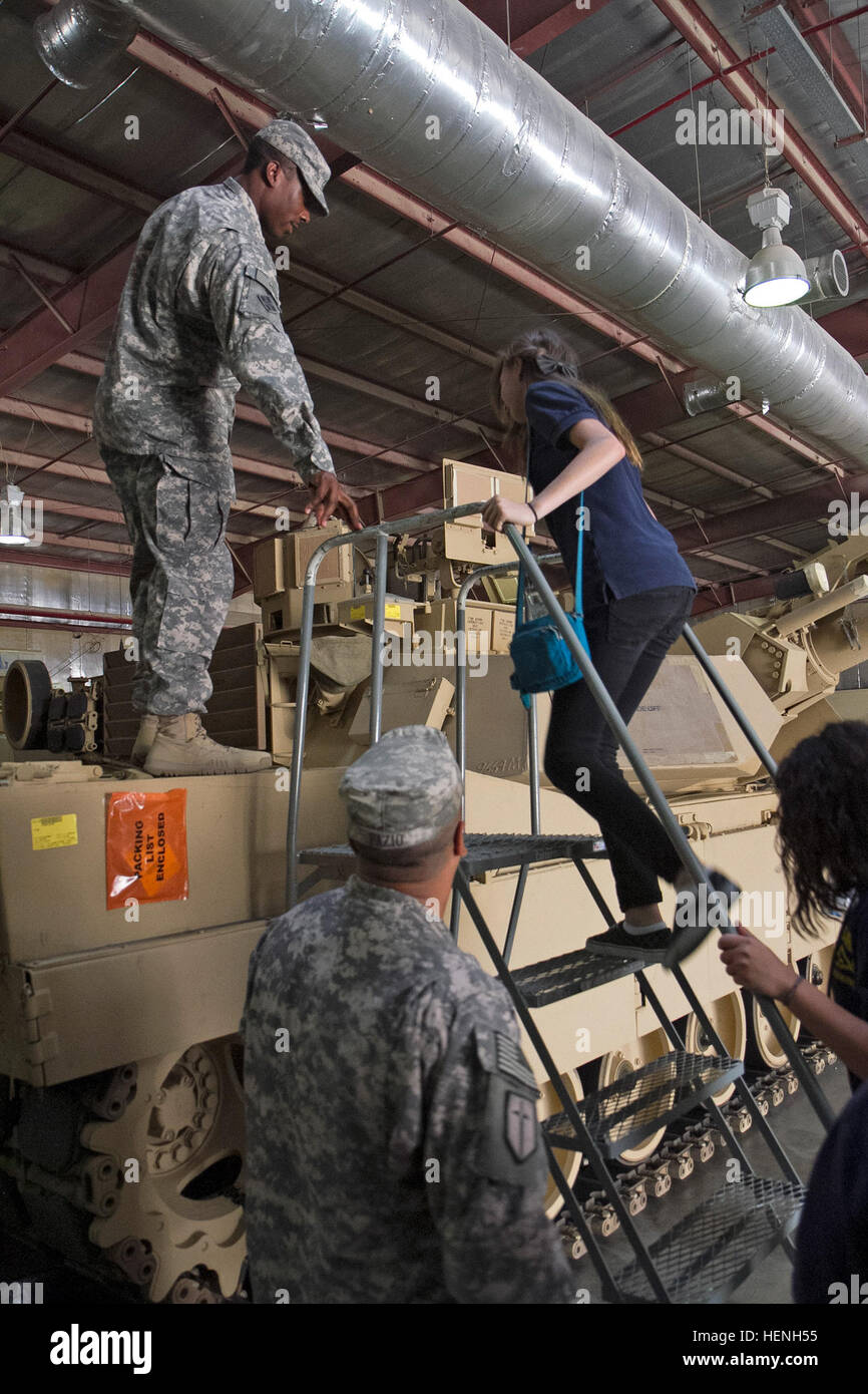 A student from the American School of Kuwait climbs aboard a M1A1 ...