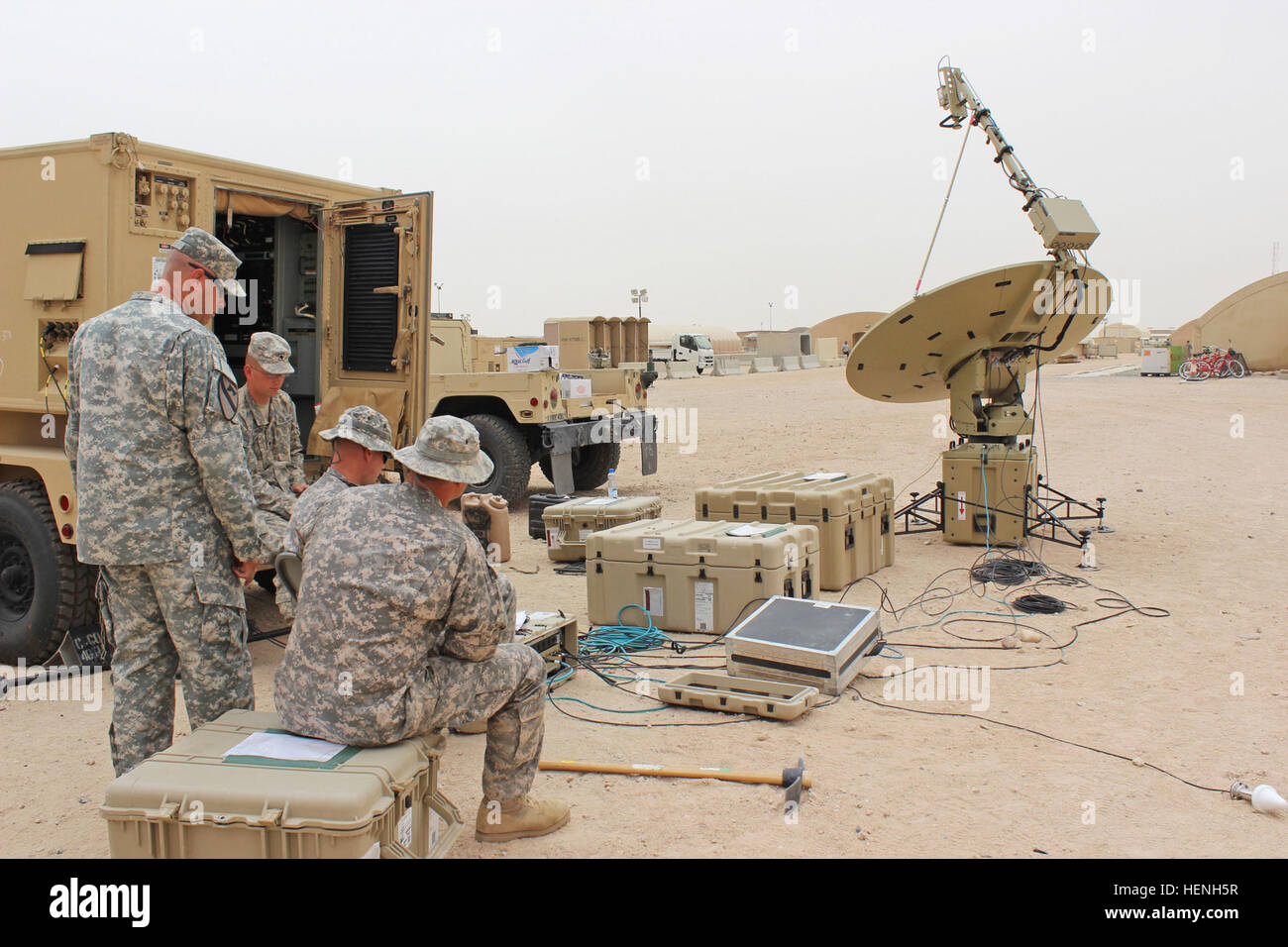 Soldiers from 40th Expeditionary Signal Battalion set up and test a Ka ...