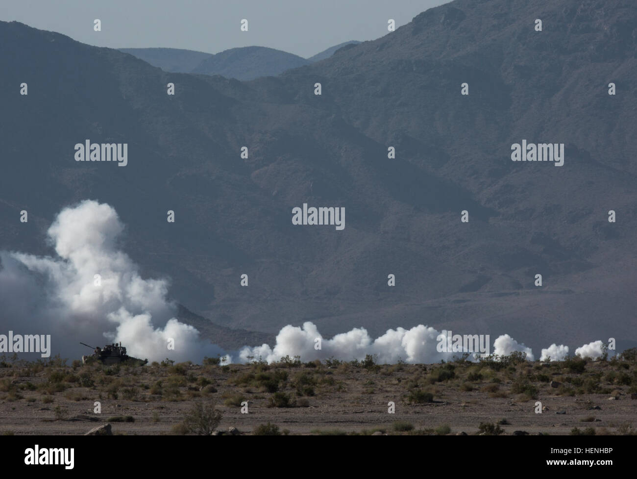 FORT IRWIN, Calif. - A group of enemy soldiers use smoke grenades as ...