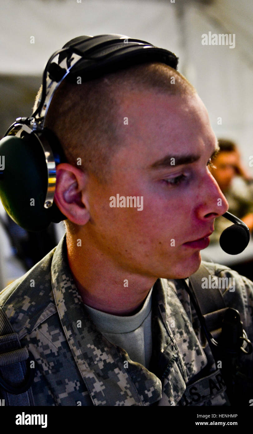 U.S. Army Pfc. John Brooks, a radio telephone operator with 3-2 Stryker ...